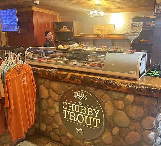 The sushi bar showcases fresh preparations behind glass, where skilled hands transform simple ingredients into edible art you'll actually want to eat.