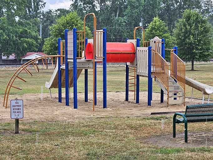 Oak Street Park's playground equipment promises hours of fun for kids while parents relax on nearby benches.