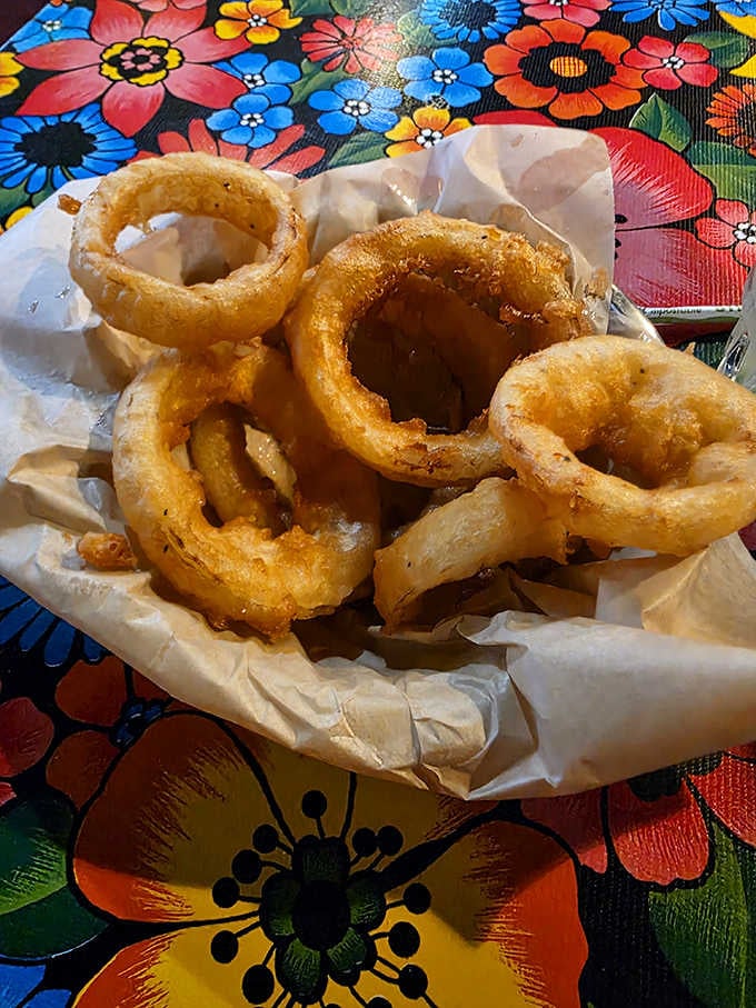 Onion rings so perfectly golden and crispy, they could moonlight as edible jewelry at fancy dinner parties.