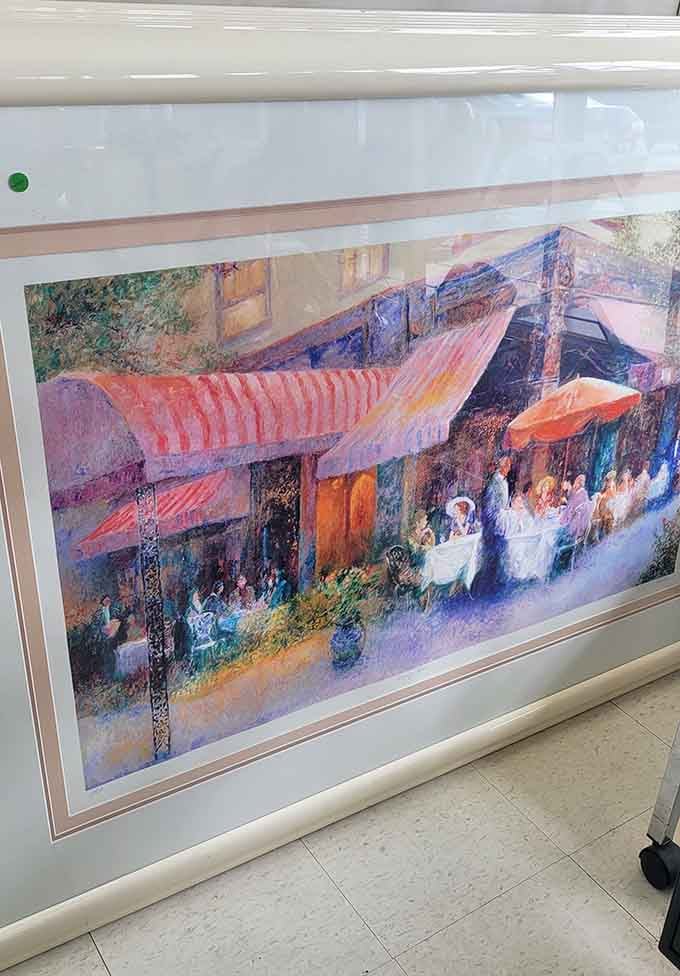 This caf&eacute; scene artwork brings European charm to your walls without the transatlantic flight or jet lag involved.