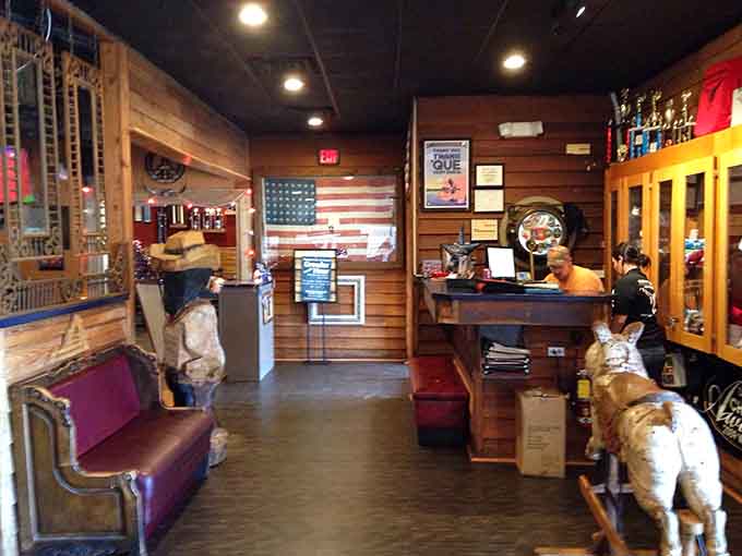 Wooden walls and Americana decor greet you at the entrance, setting the tone for authentic Southern hospitality ahead.