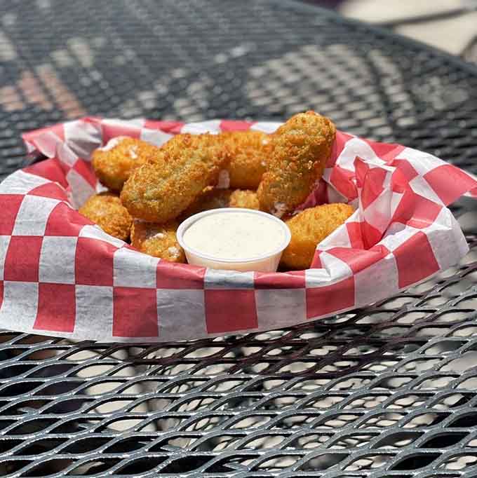 Golden-fried jalape&ntilde;o poppers served in a red checkered basket&mdash;comfort food that knows exactly what it's doing.