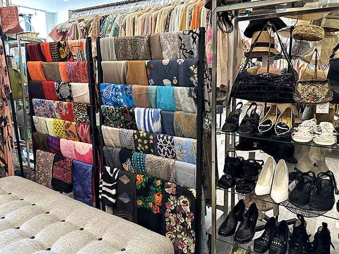 Scarves and handbags organized like a department store display, minus the department store attitude.