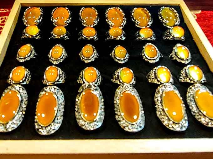 Rings featuring amber stones set in ornate metalwork that make modern mall jewelry look tragically uninspired.