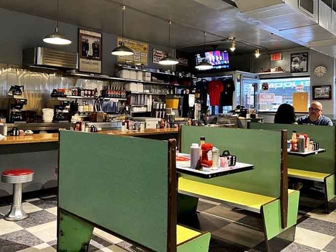 Booth seating in cheerful green, because apparently DeLuca's believes breakfast should be as colorful as possible.