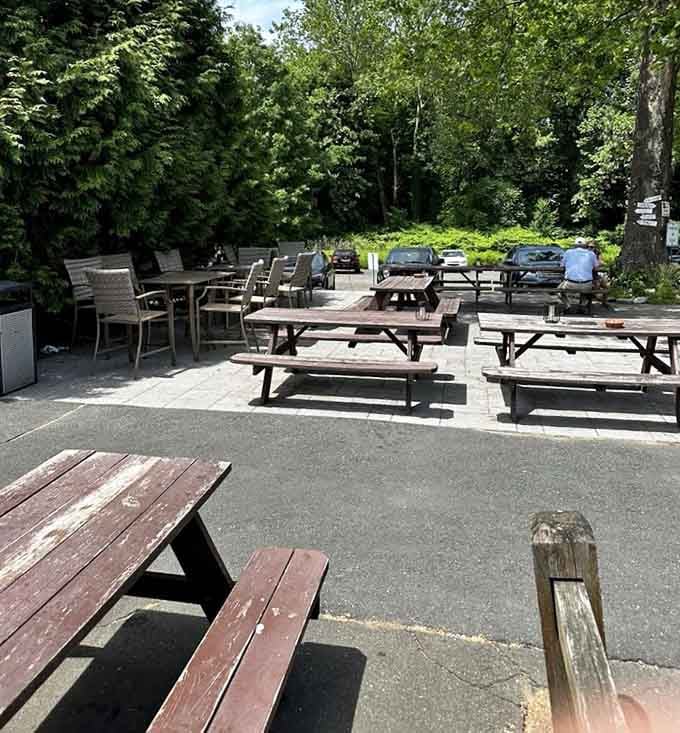 Picnic tables spread across the grounds like an invitation to slow down and actually enjoy your lunch.