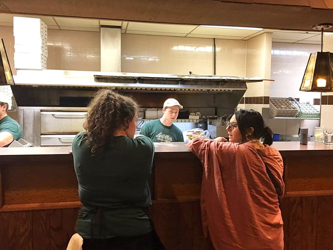 The open kitchen lets you watch the magic happen while anticipating your own deep dish masterpiece.