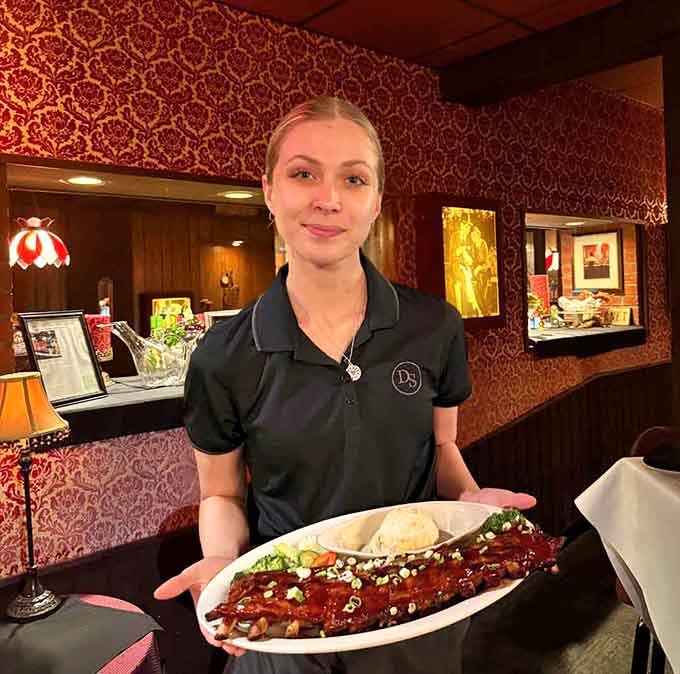 Friendly staff delivering plates piled high with BBQ ribs that'll have you licking your fingers without shame.