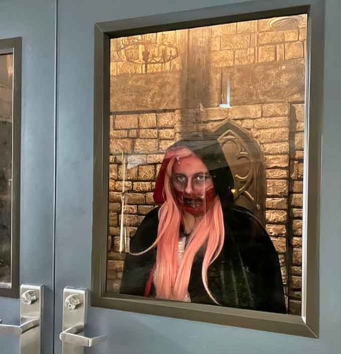 Pink hair and a creepy grin&mdash;proof that not all bathroom encounters end with just washing your hands.