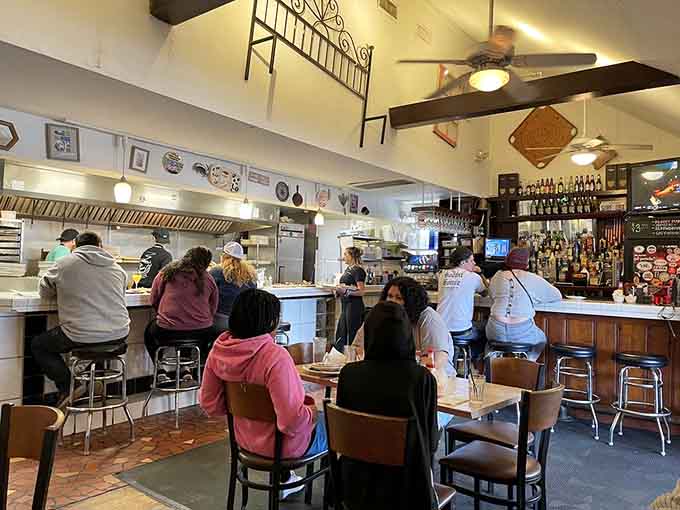 Counter seating puts you front row for the breakfast show, where eggs crack and bacon sizzles on command.