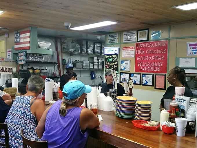 The counter buzzing with activity and chalkboard specials shows this is where the magic happens and orders fly.