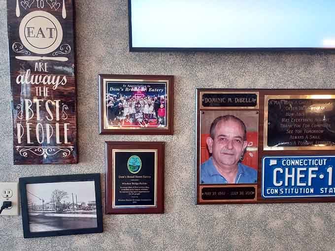 Wall decorations and community photos remind you that the best restaurants are built on relationships, not just recipes.