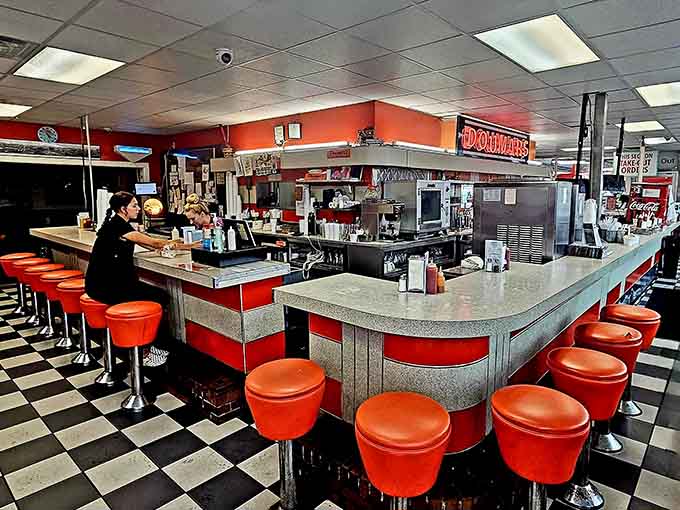 The retro counter with its orange stools invites you to sit, stay awhile, and watch history being made fresh.