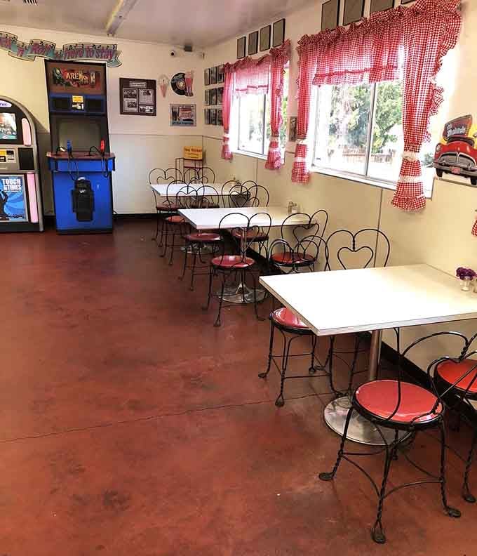 Red-checkered curtains and vintage charm create the perfect setting for making memories over burgers and shakes together.