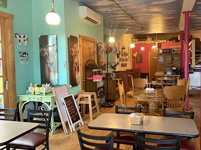 Eclectic decor mixing cow figurines with vintage finds gives the space personality that chain restaurants can't replicate.