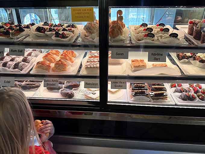 The dessert case displaying pastries that could make a grown adult weep with joy and anticipation simultaneously.