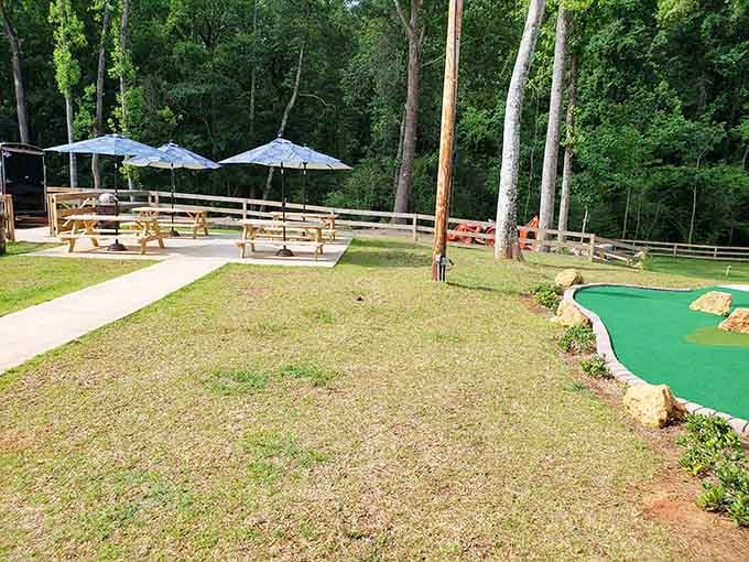 Shaded seating areas with umbrellas mean spectators can relax comfortably while watching the putting drama unfold.