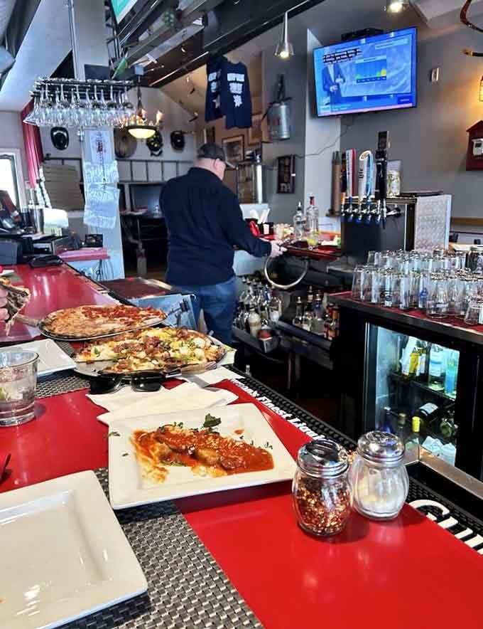That bar setup means business, with draft lines and bottles ready to complement whatever you're eating tonight.