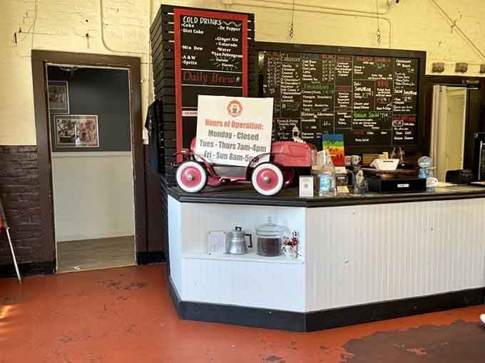 The counter area where orders happen, complete with a charming toy fire truck that makes everyone smile just a little.