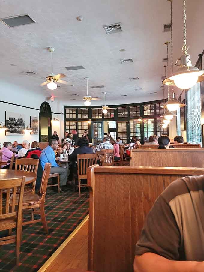 Spacious dining room with booth seating and original architectural details that money can't replicate these days.
