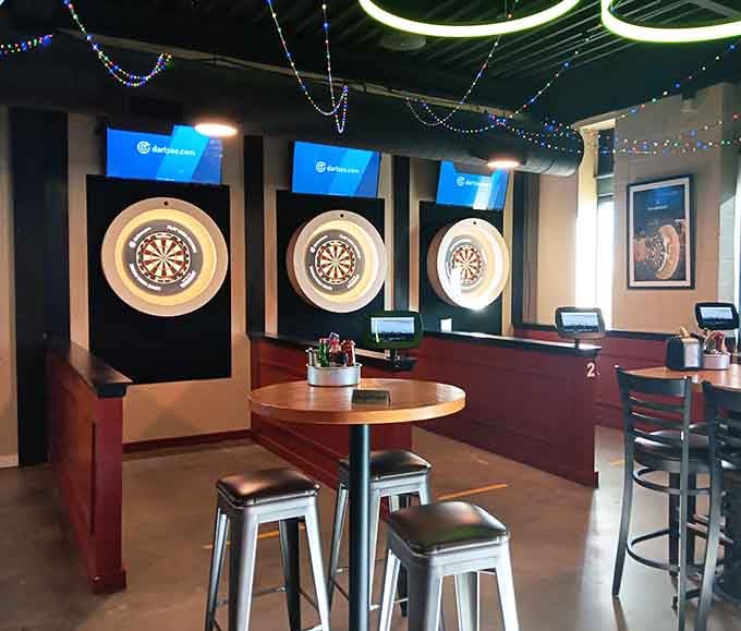 Three dartboards lined up like runway lights; your aim might be questionable, but the entertainment value is absolutely guaranteed.