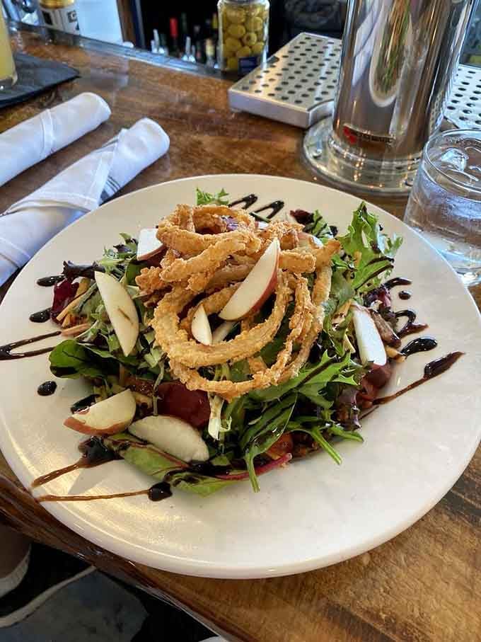 When your salad comes with crispy onion strings and sliced apples, you're not eating rabbit food – you're eating art.