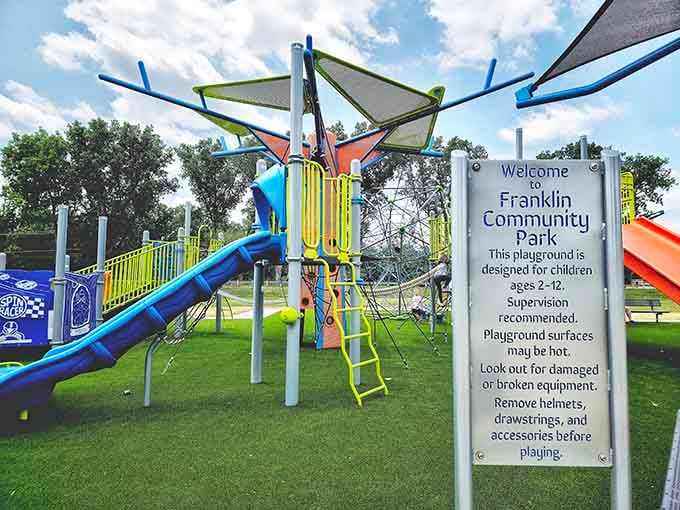 Franklin Community Park's colorful playground equipment practically vibrates with the energy of a thousand happy summer days.
