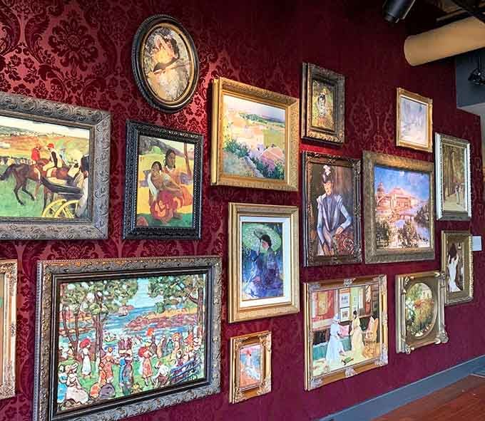 That burgundy gallery wall packed with paintings creates a visual feast that would make any art collector weep.