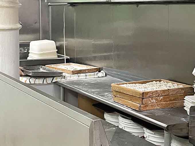 Bamboo steamers stacked like edible skyscrapers, each level holding treasures worth their weight in gold.