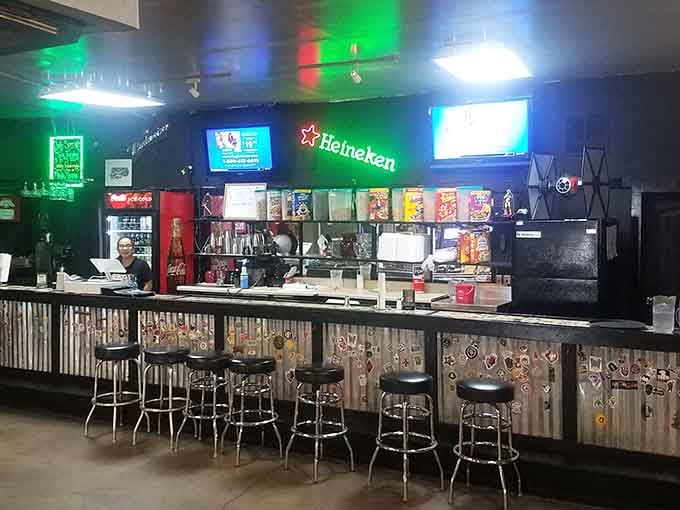 Bar seating with corrugated metal accents gives you front-row seats to watch your meal come together beautifully.