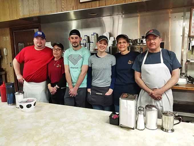 The crew behind the counter, ready to feed the masses with smiles and efficiency that only comes from genuine hospitality.