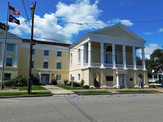 The courthouse columns stand proud and proper, reminding everyone that justice and good architecture aren't mutually exclusive concepts here.