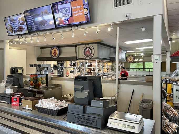 The checkout counter stands ready, but the real transaction happens at those buffet lines behind it.