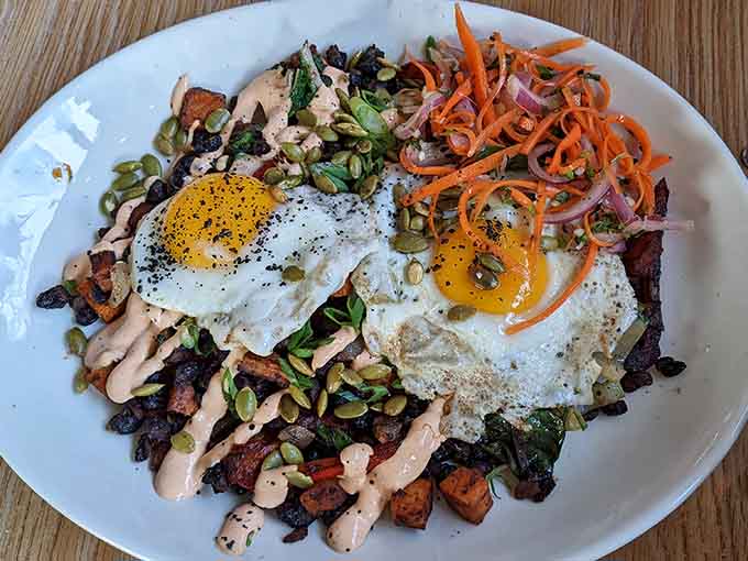 Veggie and bean hash topped with perfectly fried eggs shows that healthy eating can still be ridiculously satisfying.