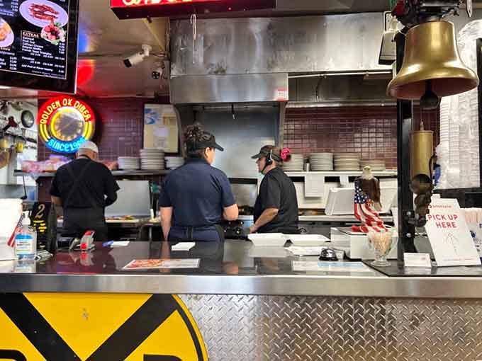 Behind the scenes where the magic happens, complete with that brass bell ready to announce your order's ready for takeoff.