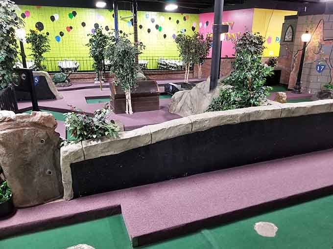 The mini golf course winds through whimsical landscapes where par means nothing and fun means everything.