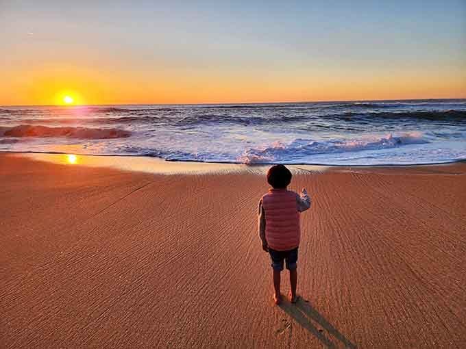 Little ones discovering sunsets never get old, especially when the Pacific puts on this kind of show.