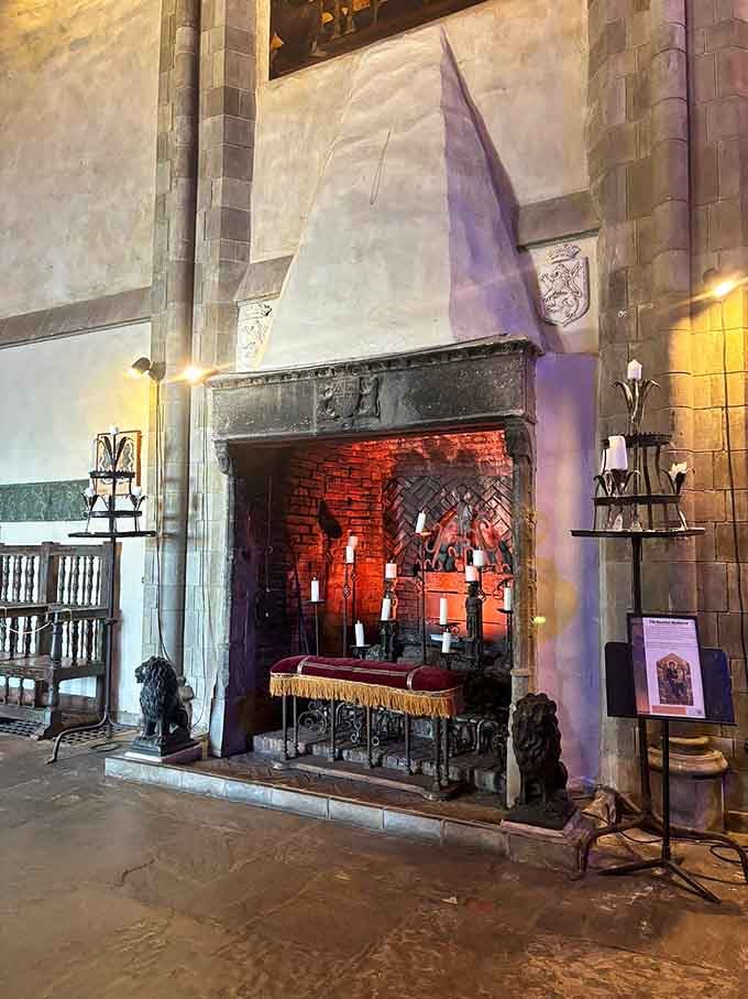 That fireplace could roast enough food for a medieval feast, flanked by guardian statues for dramatic effect.