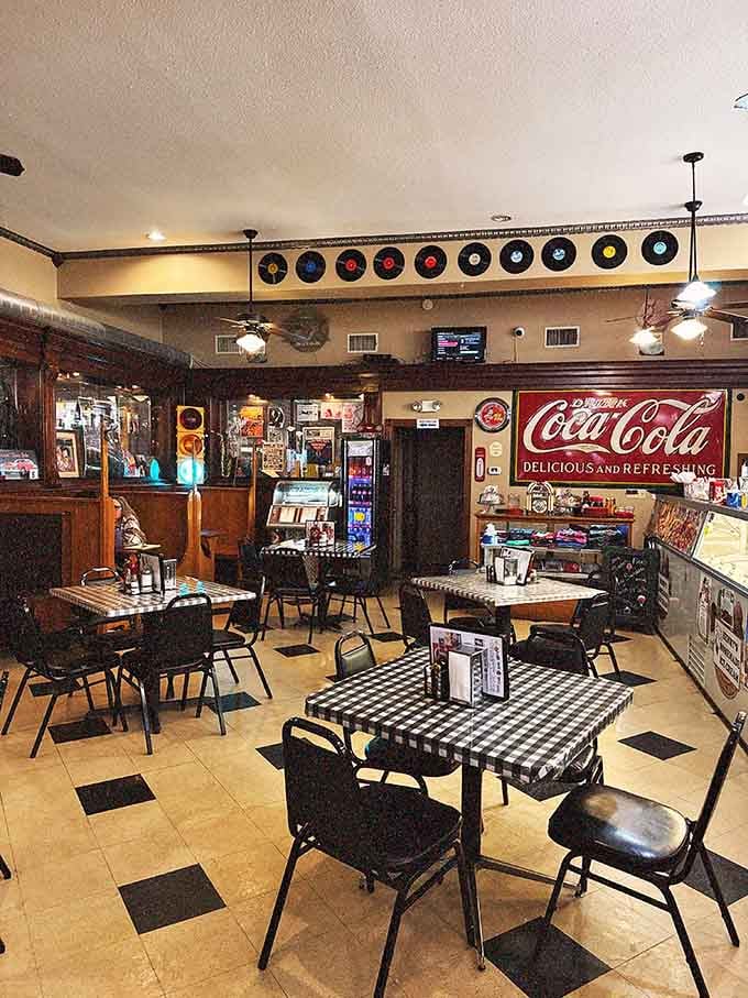 The checkered tablecloths and retro seating arrangement prove that sometimes the best meals happen when you're surrounded by happy memories.