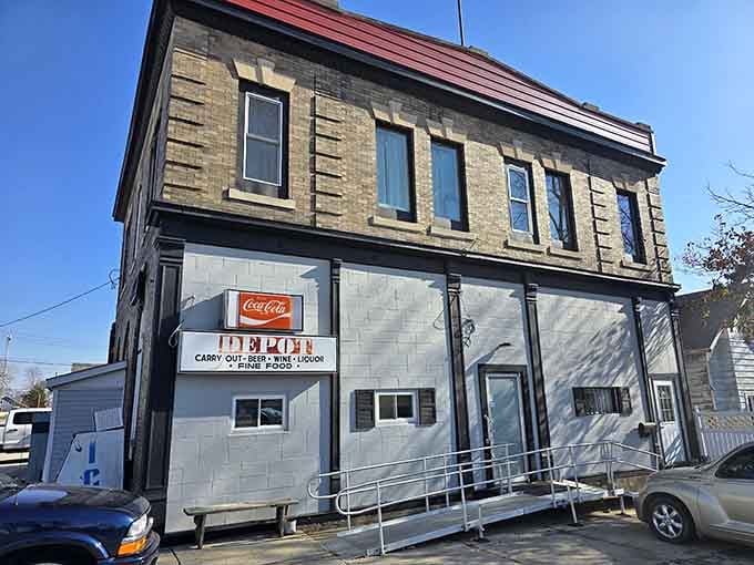 Classic Coca-Cola sign marking a local gathering spot where carry-out means supporting neighbors, not faceless corporations feeding algorithms.