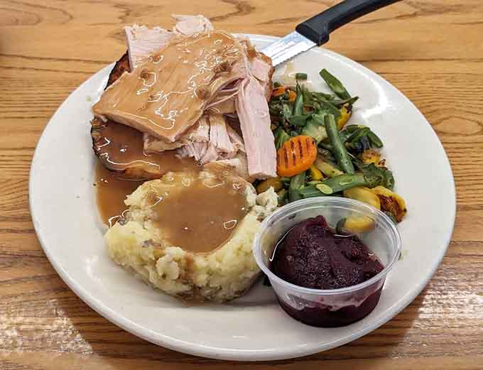 Open-faced turkey with mashed potatoes and gravy: Thanksgiving vibes available year-round, no family drama included here.