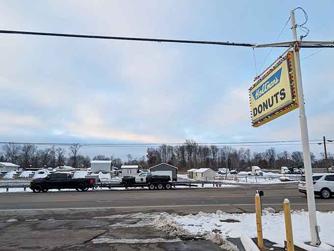 Even on winter, that sign shines like a beacon of hope, reminding you that donuts make everything better always.
