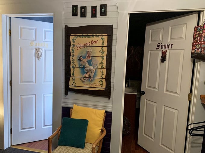 Bathroom doors labeled "Sinner" and "Saint" because even necessary breaks deserve a sense of humor here.