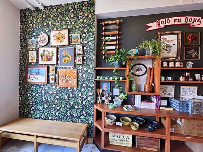 Vintage botanical wallpaper and curated art transform a simple corner into an Instagram-worthy moment of design perfection.