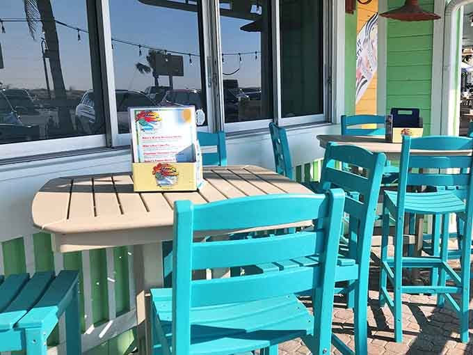 Bright turquoise chairs on the deck make every meal feel like a vacation, even if you're just on lunch break.