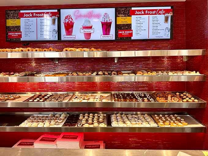 Row after row of fresh donuts lined up like edible soldiers ready to make your day infinitely sweeter.