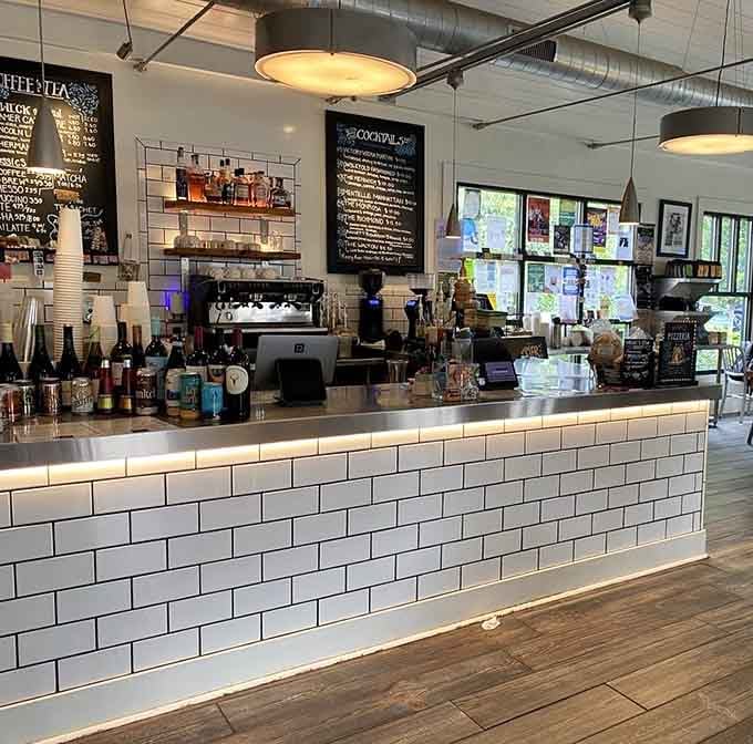 The subway tile counter gleams under industrial lighting, proving that functional spaces can still be absolutely gorgeous and Instagram-worthy.