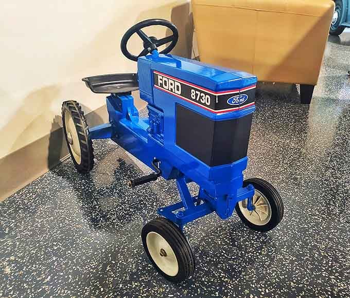 Even the pedal tractors get the royal treatment here, proving nostalgia comes in all sizes and horsepower.