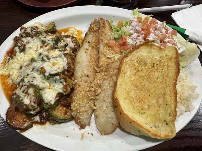 Filete a mojo de ajo with garlic butter and sides proves this cafe does more than just enchiladas&mdash;though why order anything else?