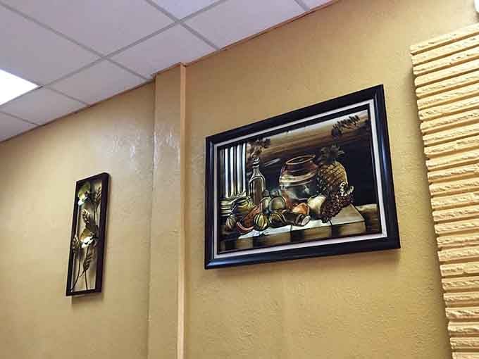 Modest wall decorations add warmth without distraction, keeping your focus where it belongs: on the plate.